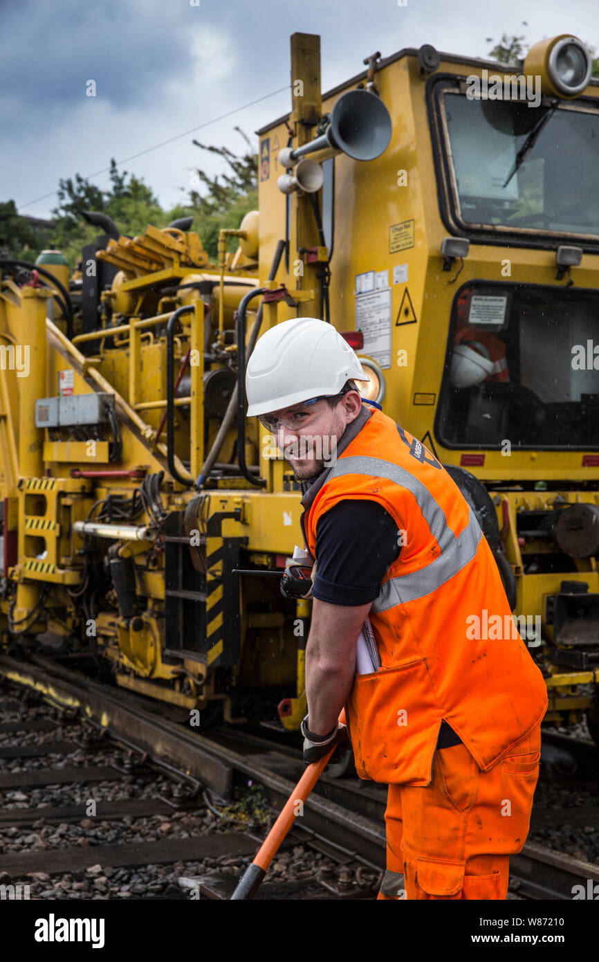 Maintenance team work on London Underground Central Line. Tack defect ...