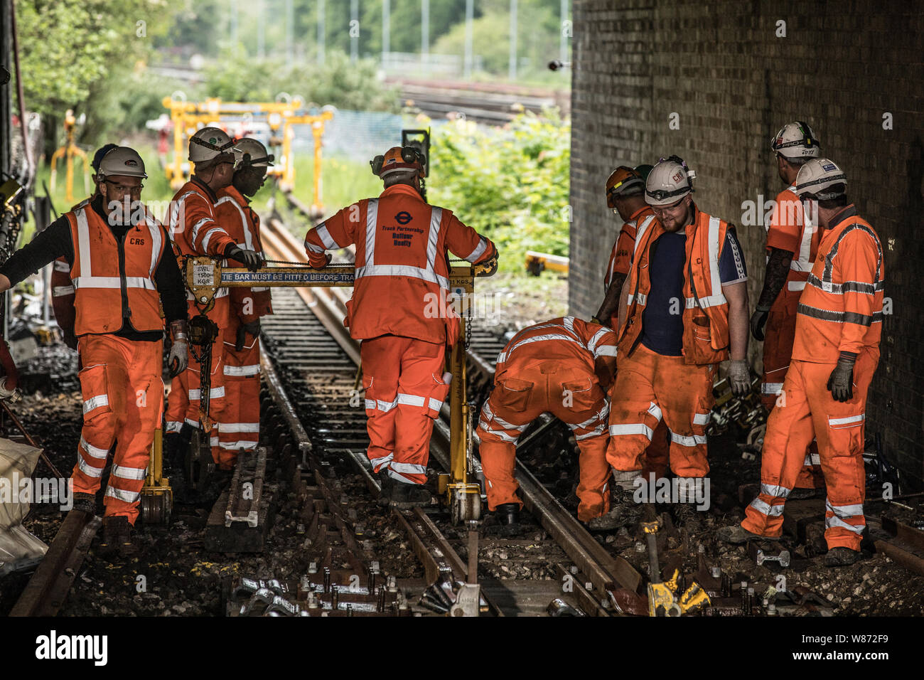 Maintenance team work on London Underground Central Line. Tack defect ...