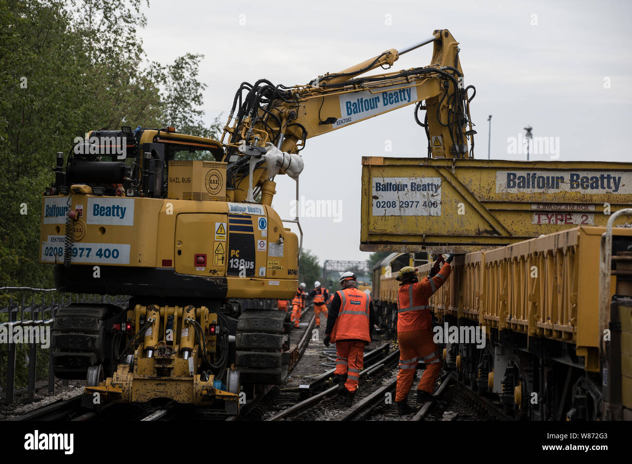 Maintenance team work on London Underground Central Line. Tack defect ...