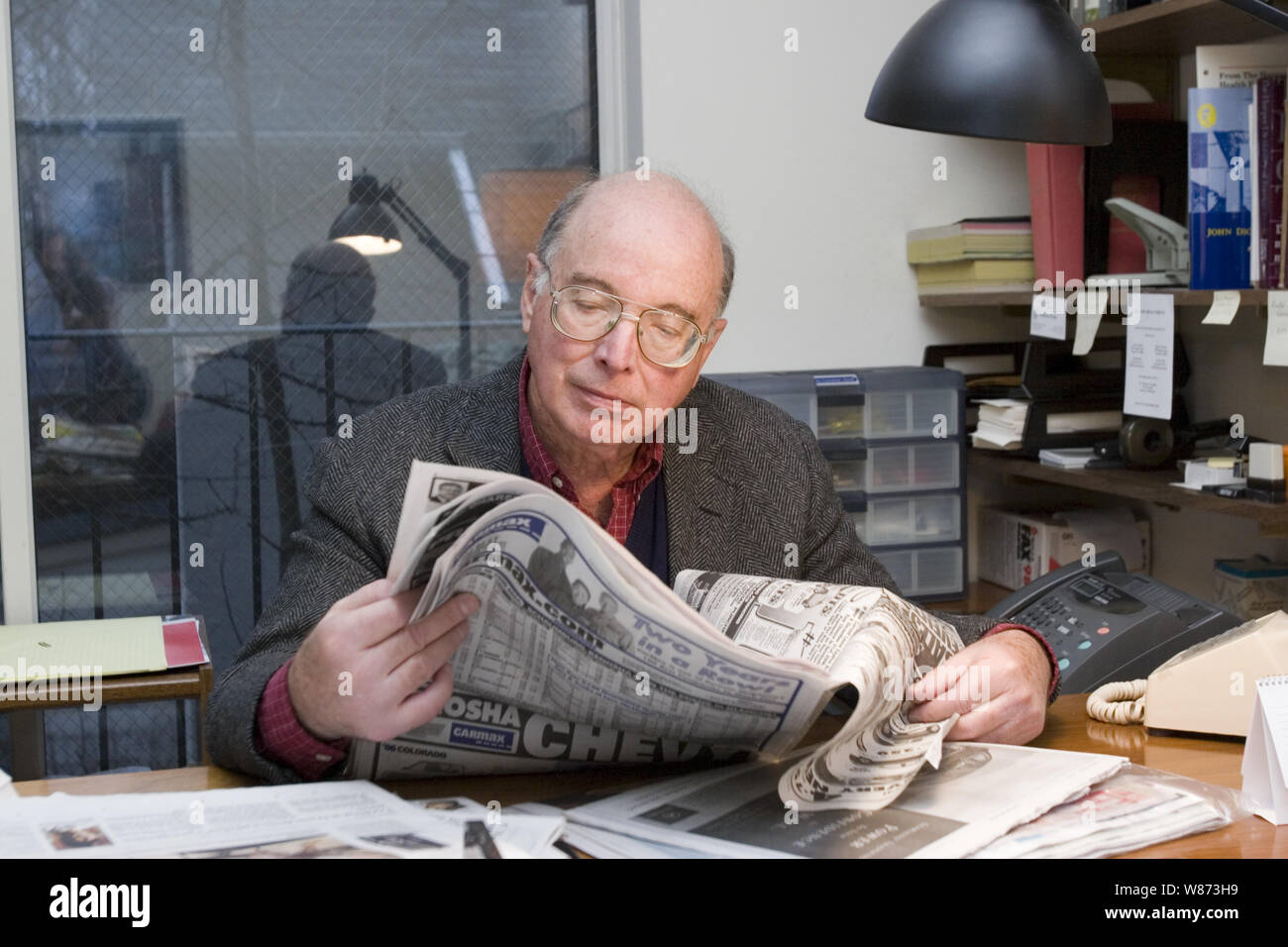 Man reads the newspaper in his office. MR Stock Photo - Alamy