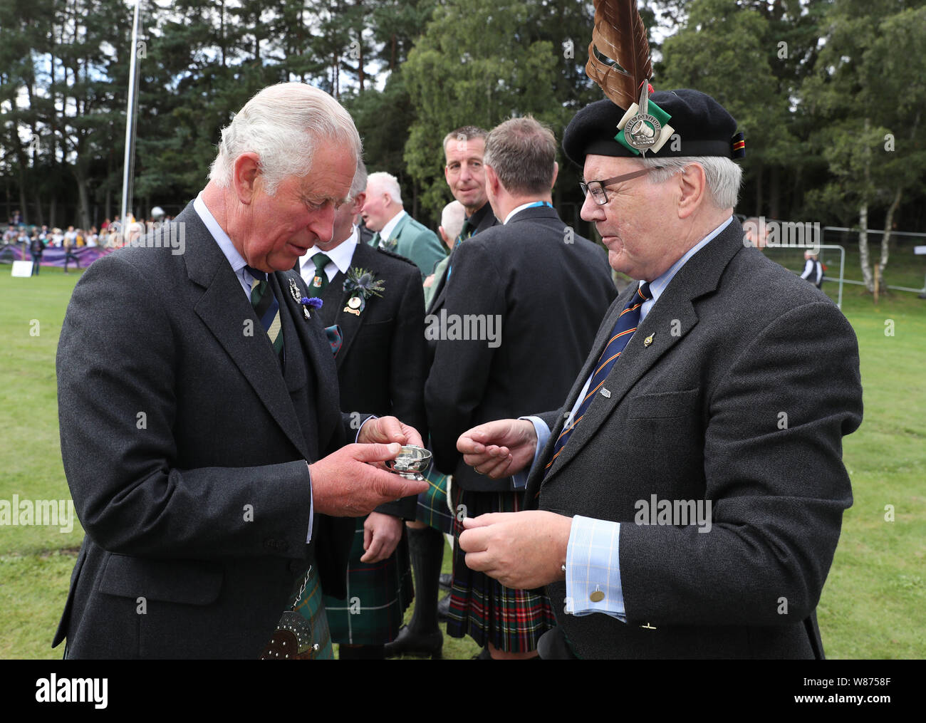 The Prince of Wales, known as the Duke of Rothesay while in Scotland, is offered a whisky from ...