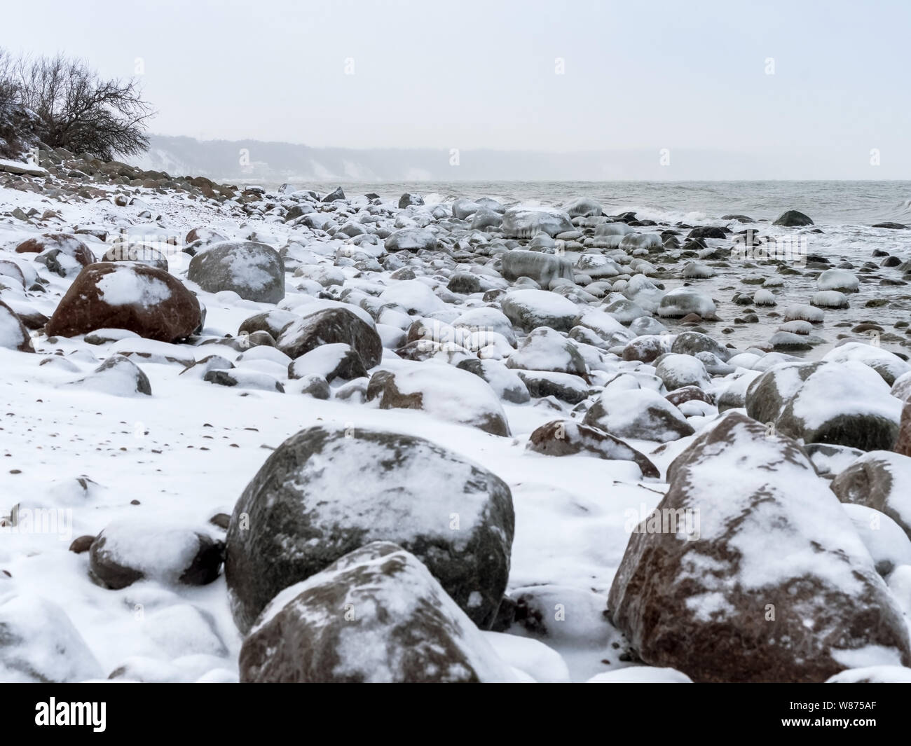 seashore in winter, rocky coast in the snow Stock Photo - Alamy