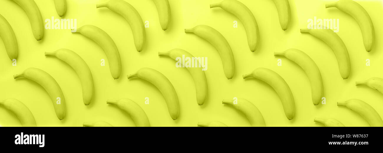 Geometric colorful fruit pattern. Bananas over neon yellow color ...