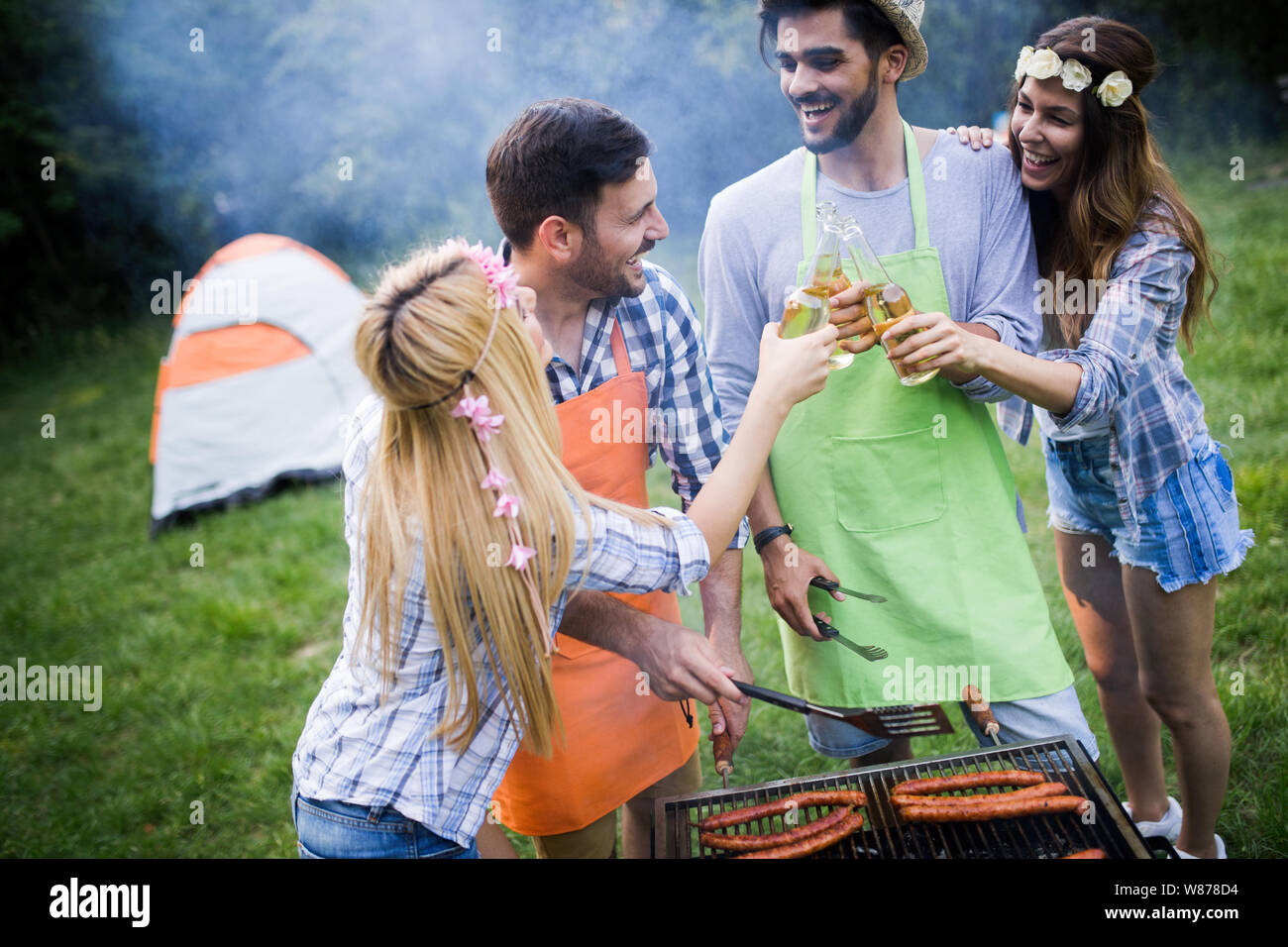 Group of friends having fun in nature doing bbq Stock Photo - Alamy