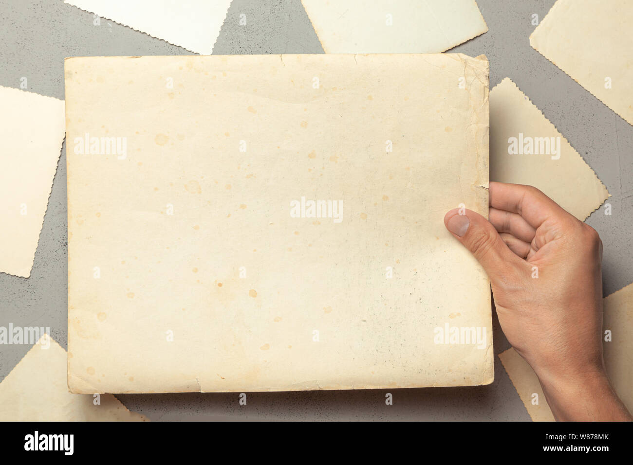 Old photo in the hands of man. Empty template for picture, mock-up ...