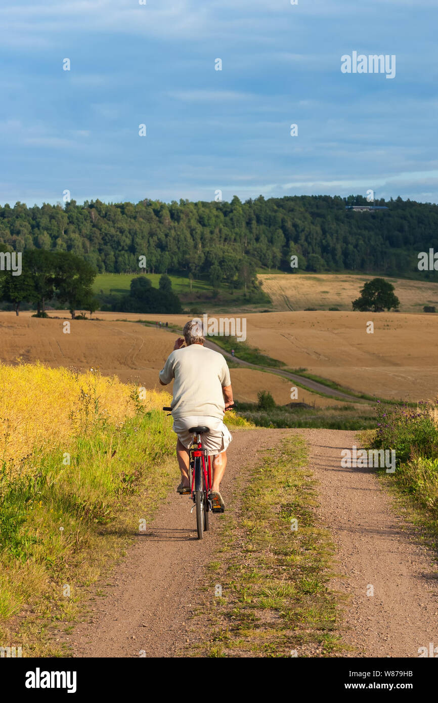 Man cycling on winding country hi-res stock photography and images - Alamy