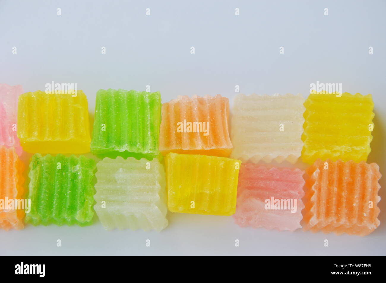colorful crispy candy on white dish Stock Photo - Alamy