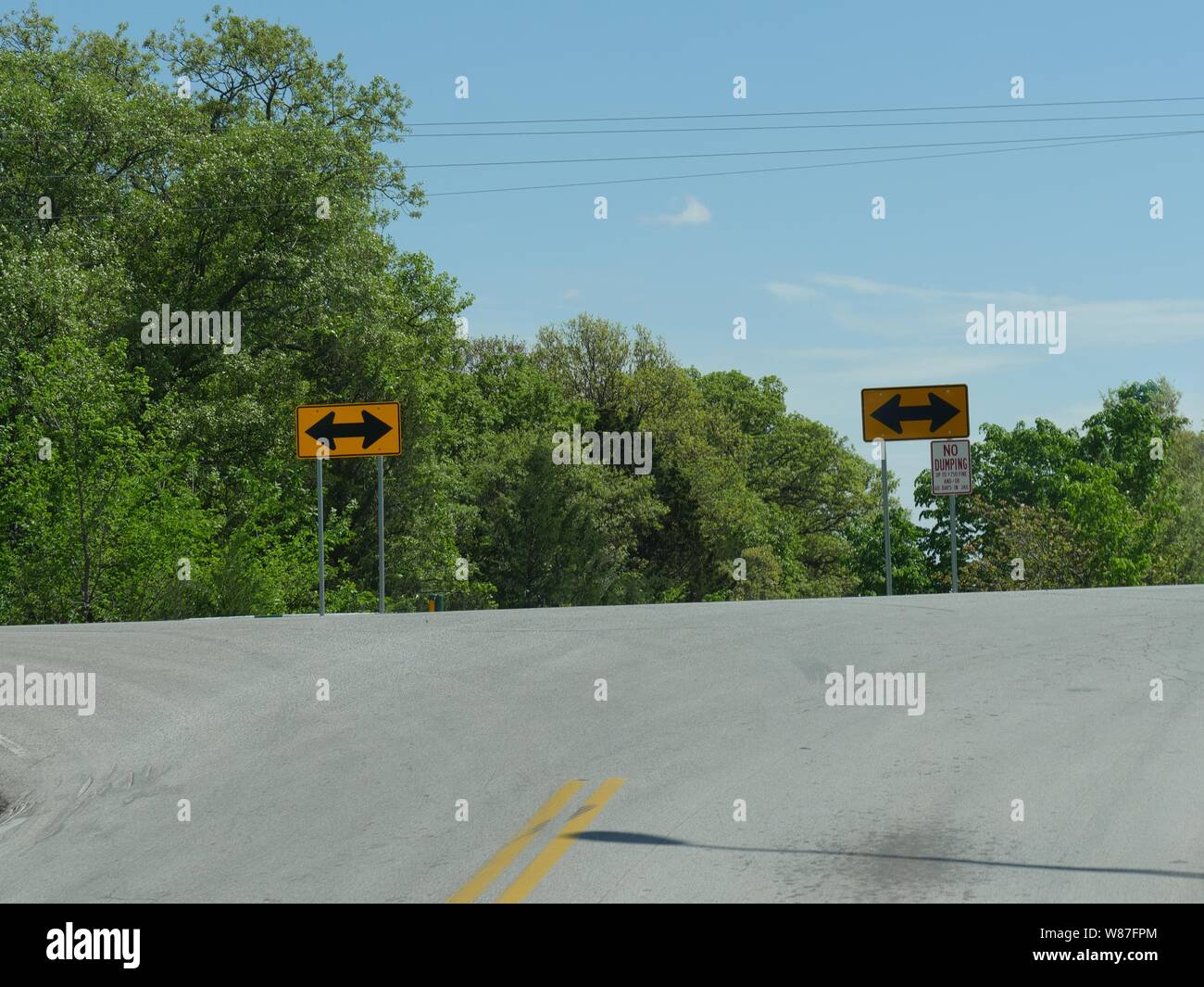 Directional arrows in the road at an intersection Stock Photo - Alamy
