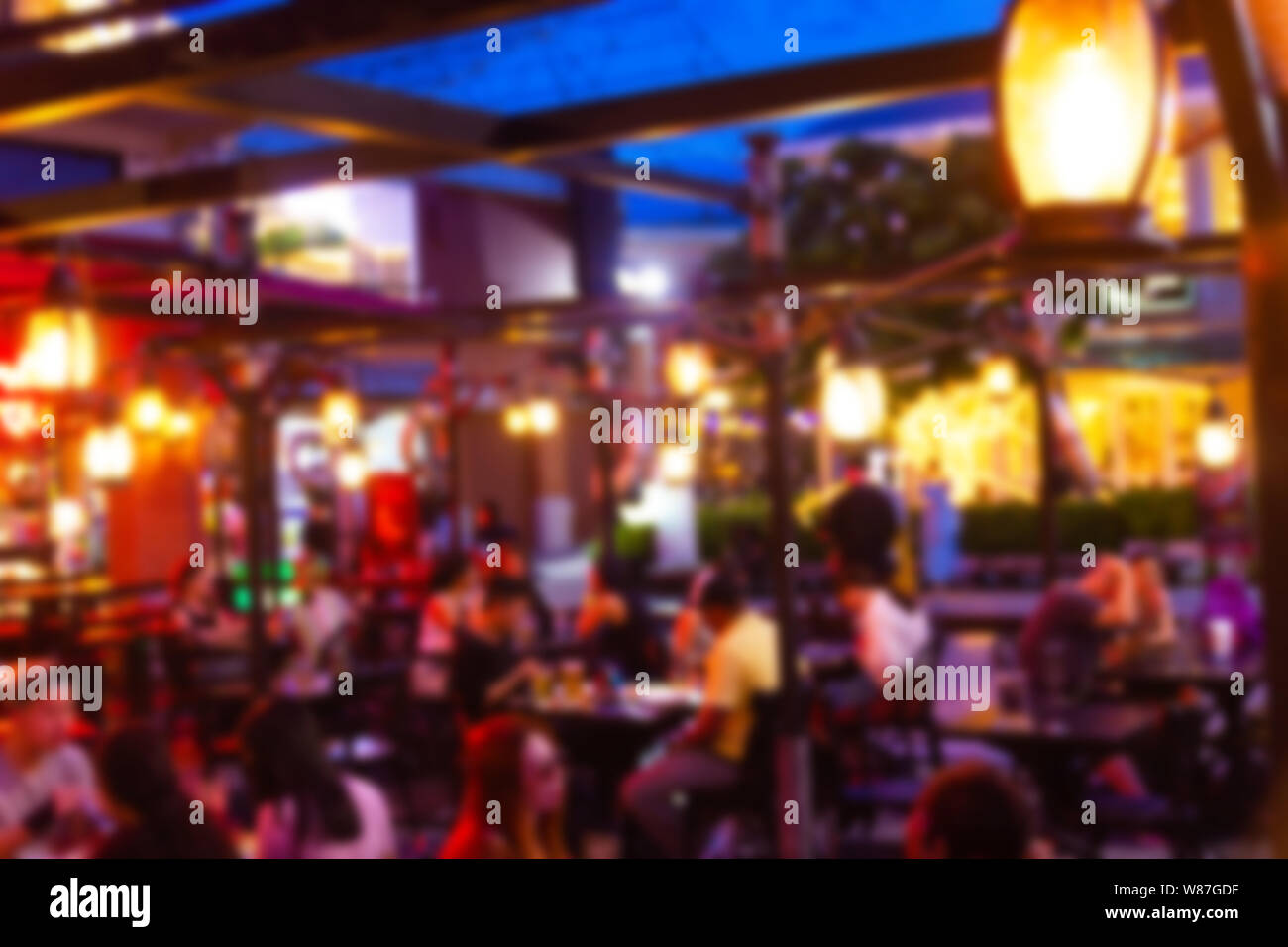 blurred image Lots of people enjoy at the bar pub fun of night festival ...