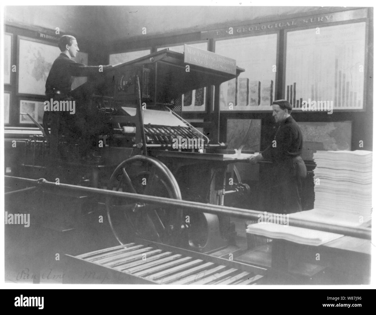 2 men operating map printing press at U.S. Geol. Survey Stock Photo - Alamy