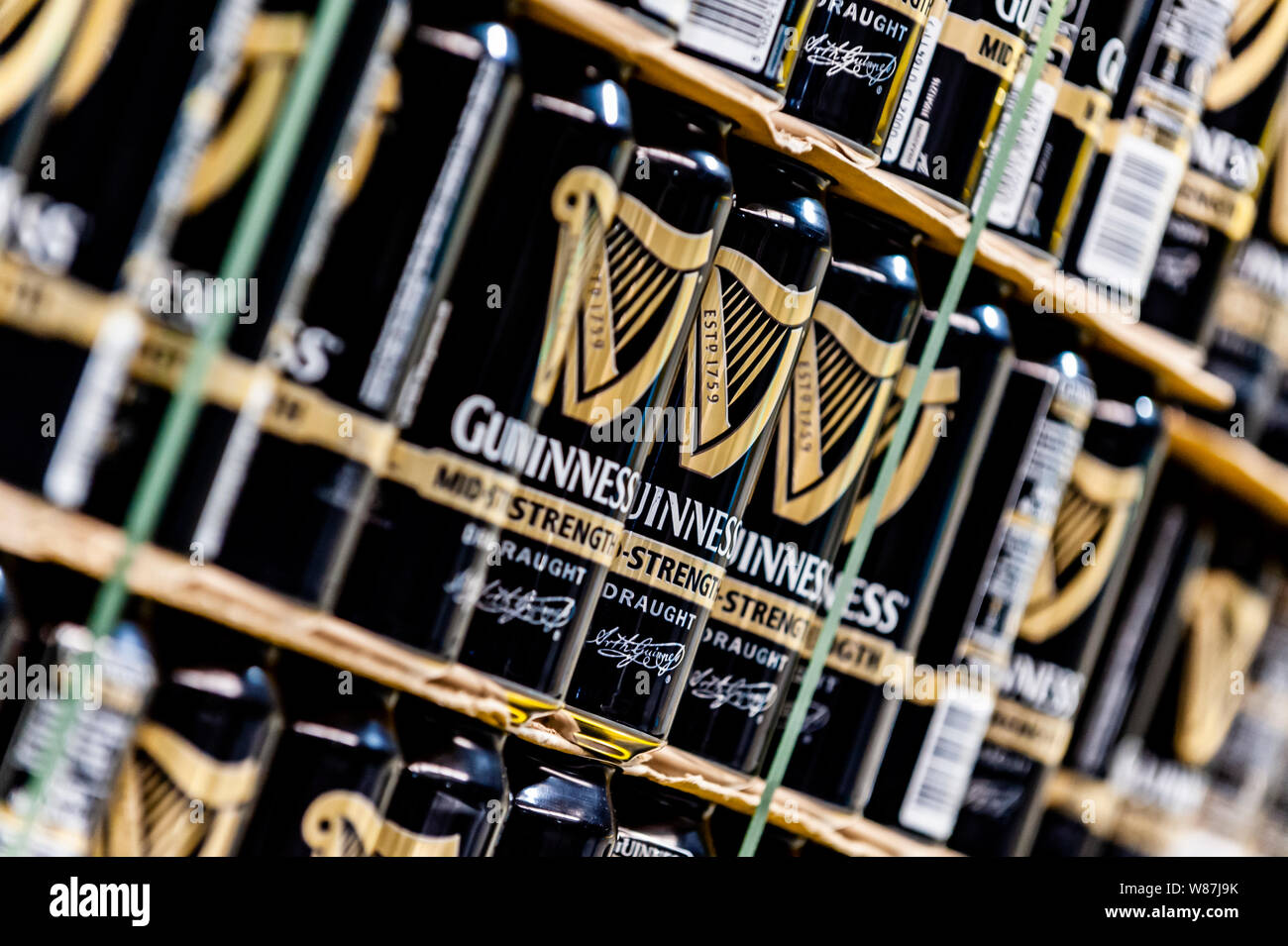 Rows of Guinness cans stored and strapped onto pallets Stock Photo - Alamy