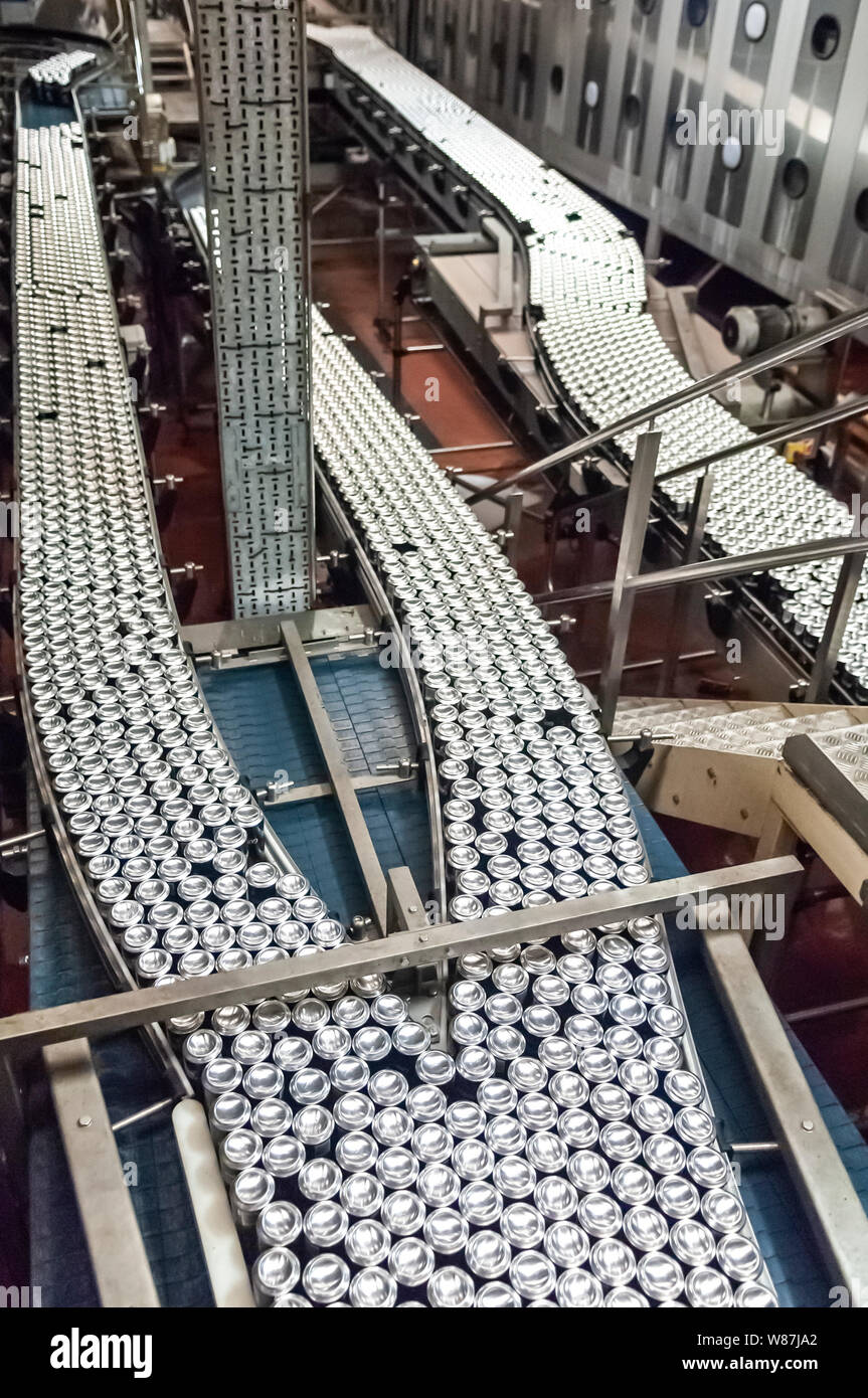 Rows of beer cans in a brewery canning plant Stock Photo - Alamy