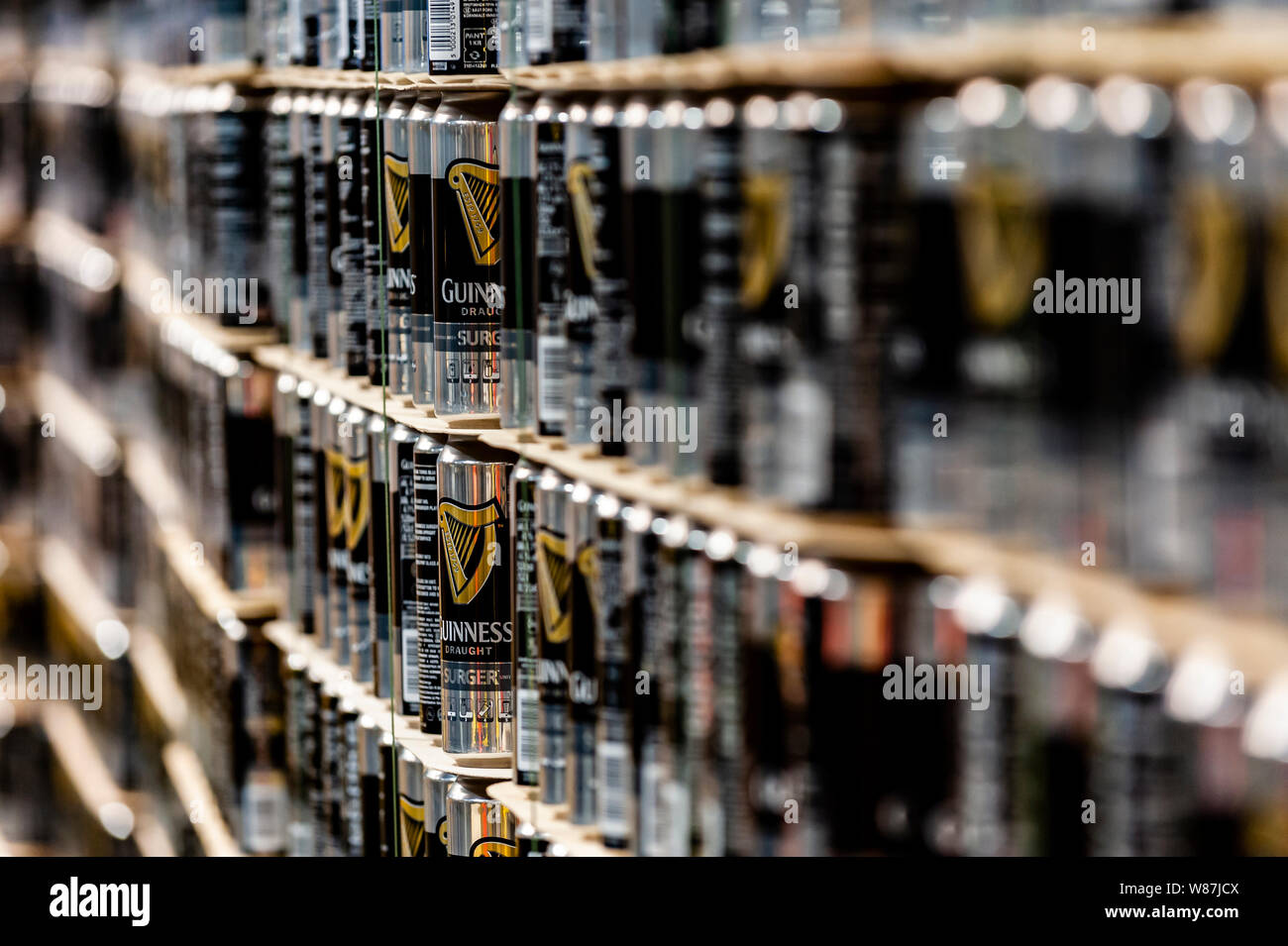 Rows of Guinness cans stored and strapped onto pallets Stock Photo - Alamy