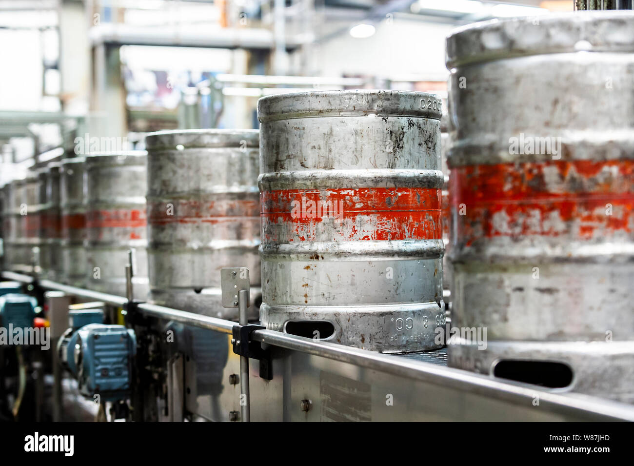 Beer kegs on a conveyor belt in a brewery manufacturing plant Stock ...