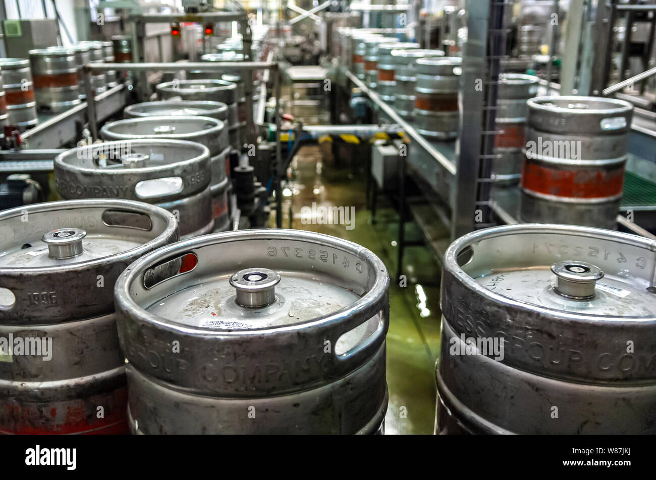 Beer kegs on a conveyor belt in a brewery manufacturing plant Stock ...