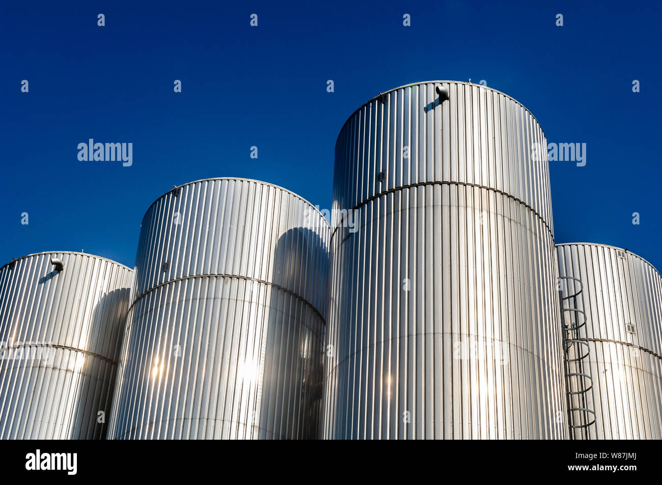Massive storage containers at a brewery manufacturing plant Stock Photo ...