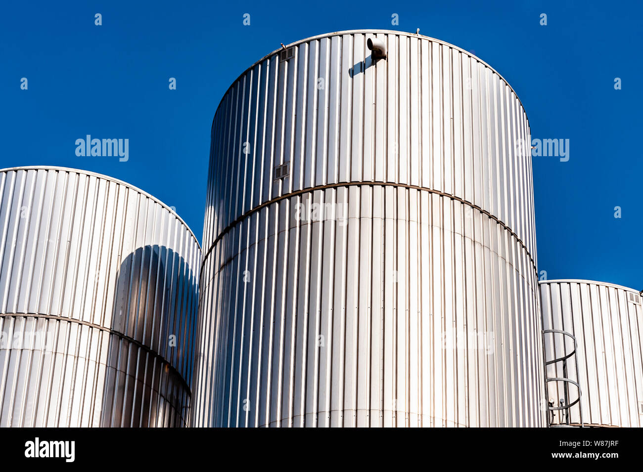 Massive storage containers at a brewery manufacturing plant Stock Photo ...