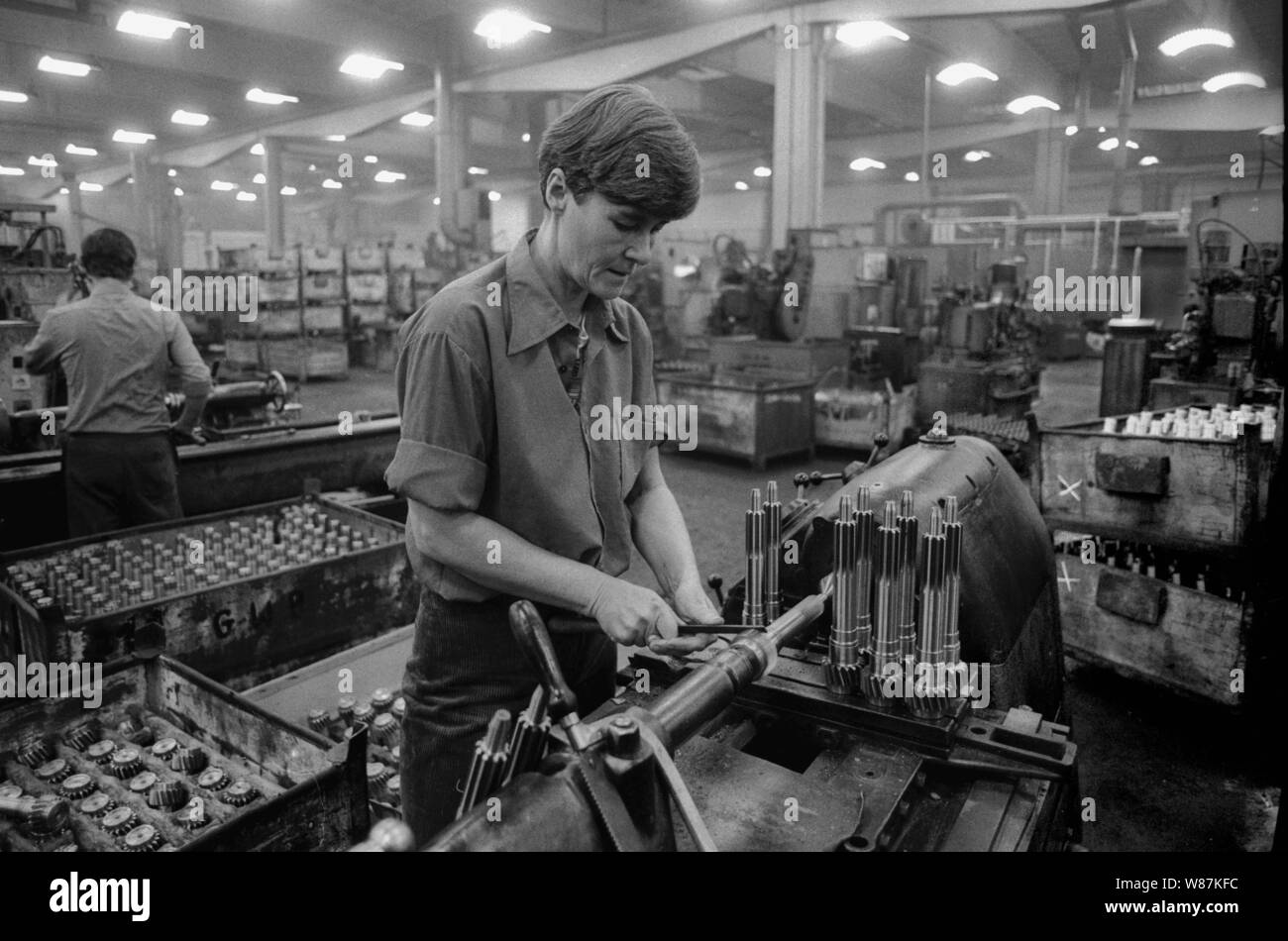 01 January 1990, Berlin, Brandenburg: A worker at a machine. December ...