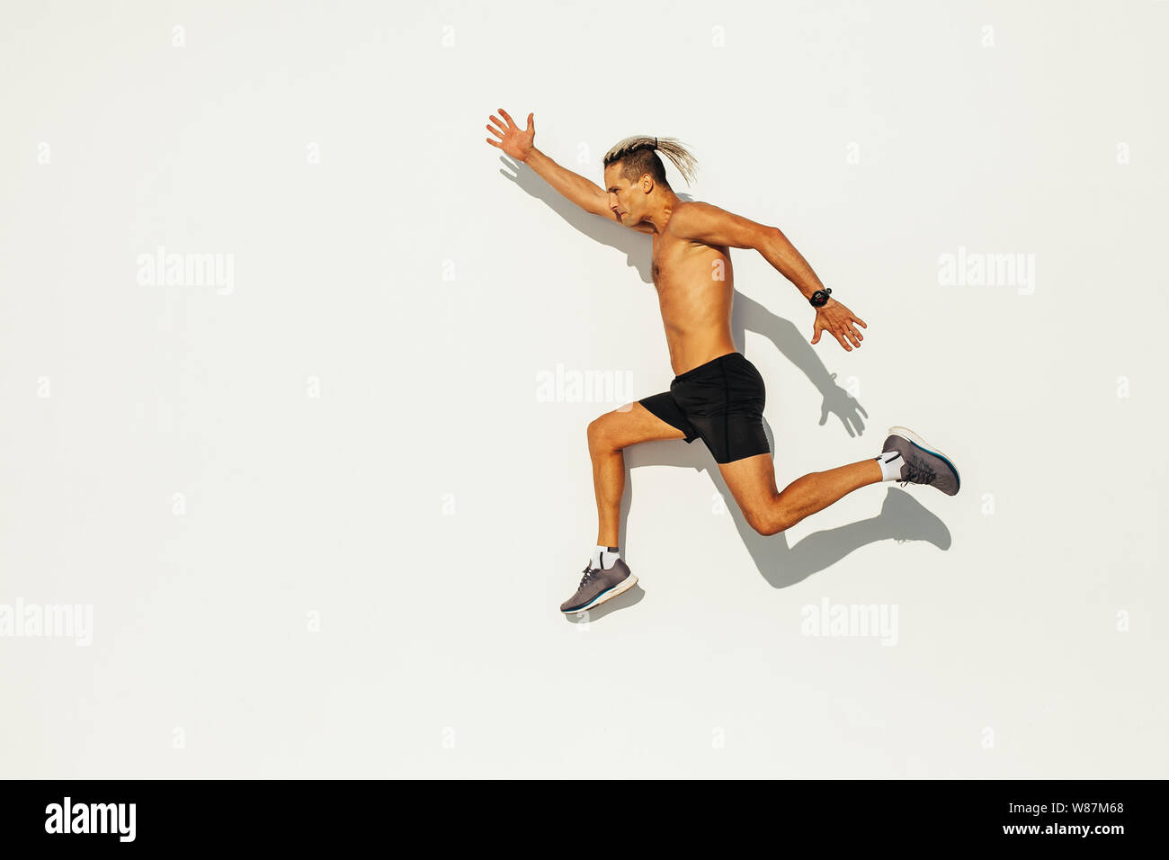 Sprinting man hi-res stock photography and images - Alamy