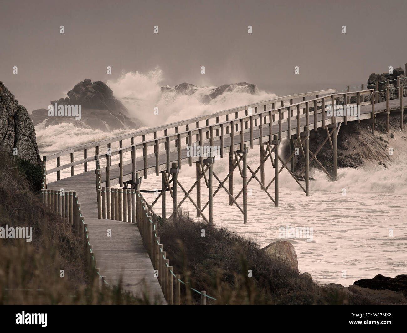 Wooden bridge over troubled waters. Photo composition Stock Photo - Alamy Wooden bridge over troubled waters. Photo composition Stock Photo - Alamy