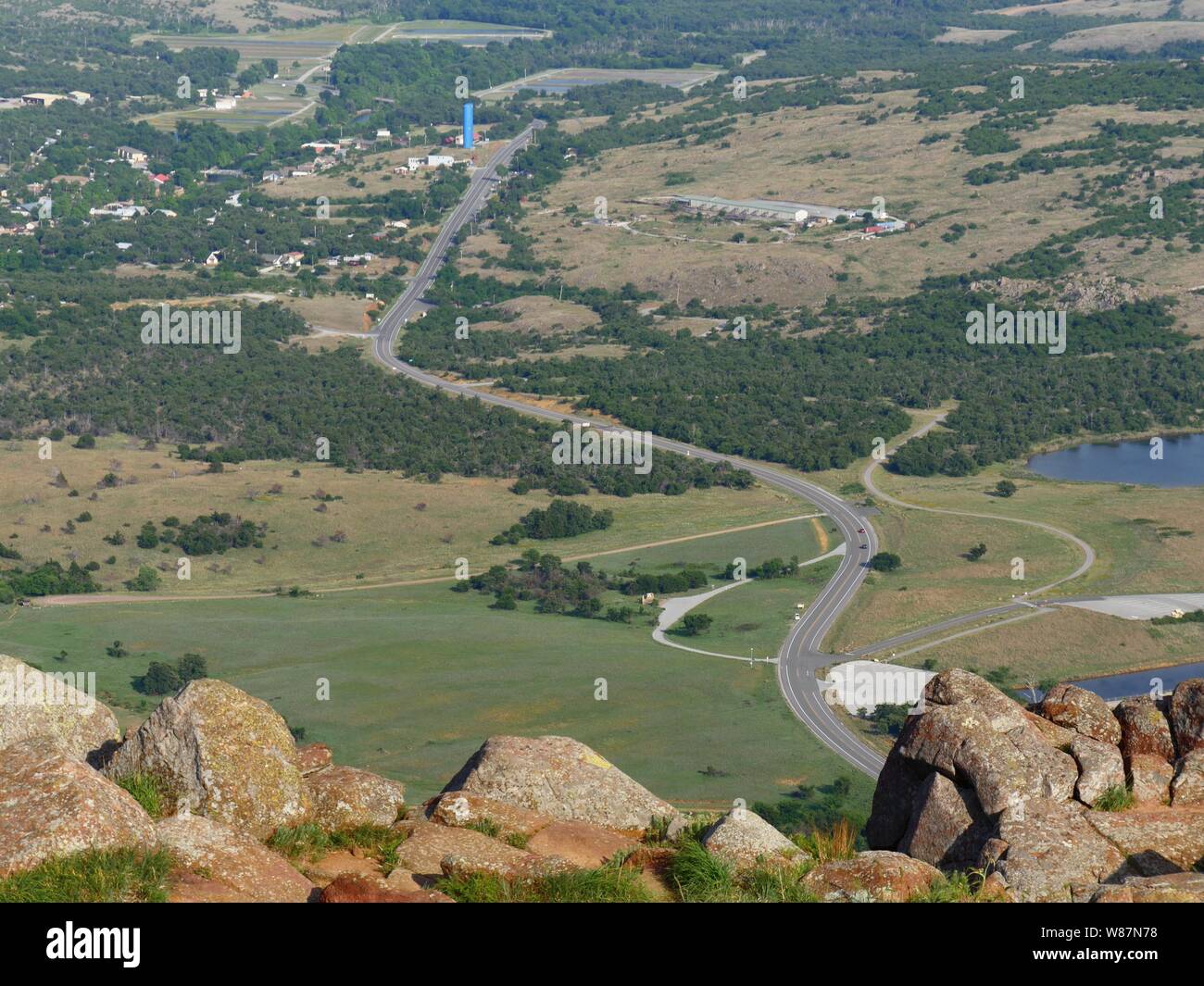 Aerial view of a winding road to Medicine Park, seen from peak of Mt ...