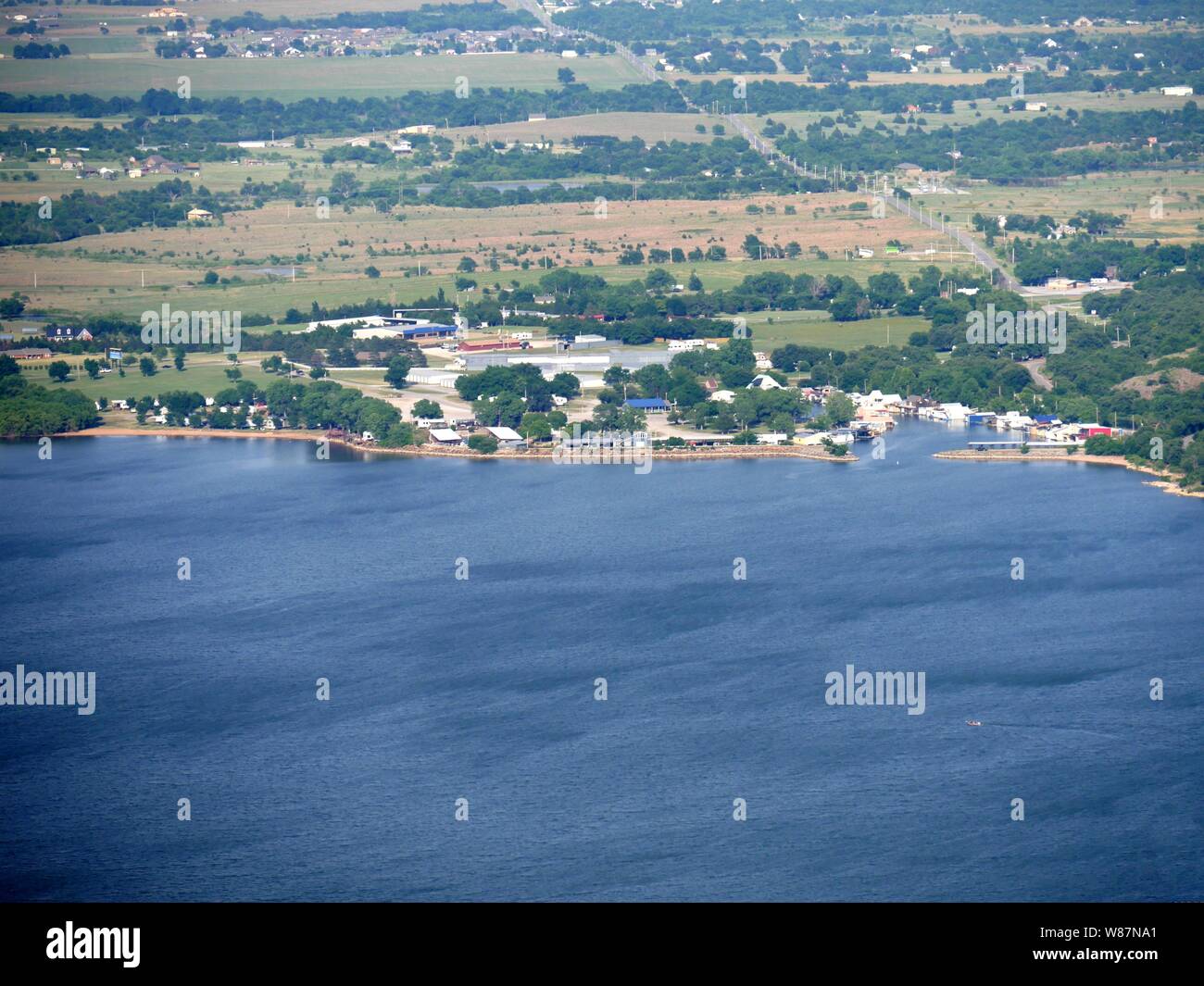 Aerial view of Lake Lawtonka with Medicine Park in the background, seen ...