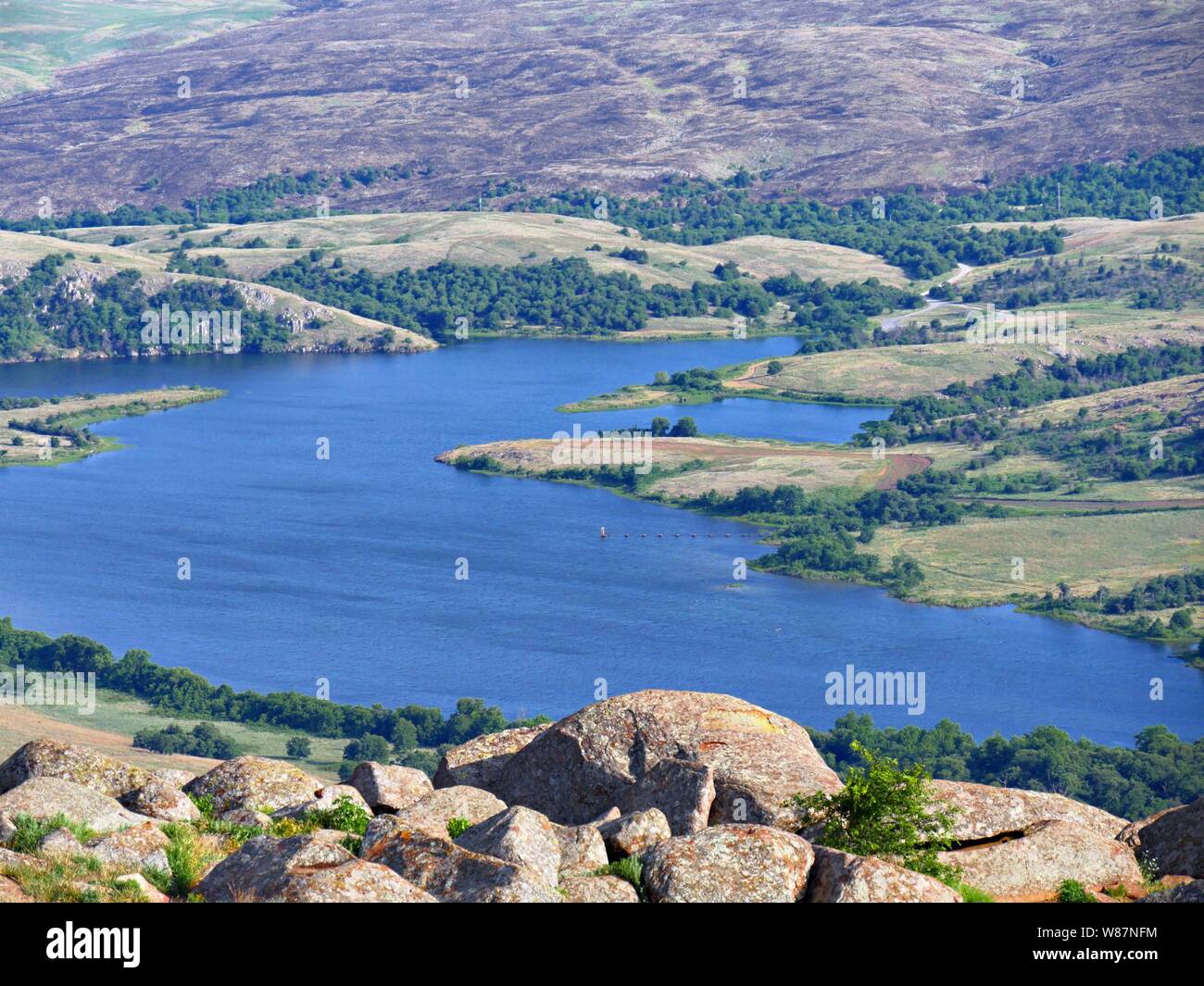 Close up aerial view of Lake Lawtonka seen from the peak of Mt. Scott ...