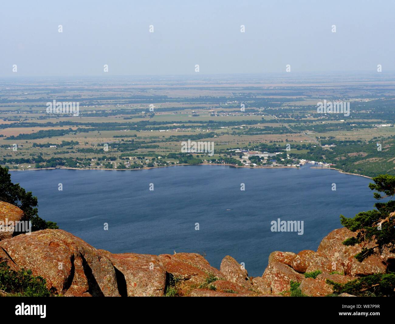 Close up aerial view of Lake Lawtonka, seen from the peak of Mt. Scott ...