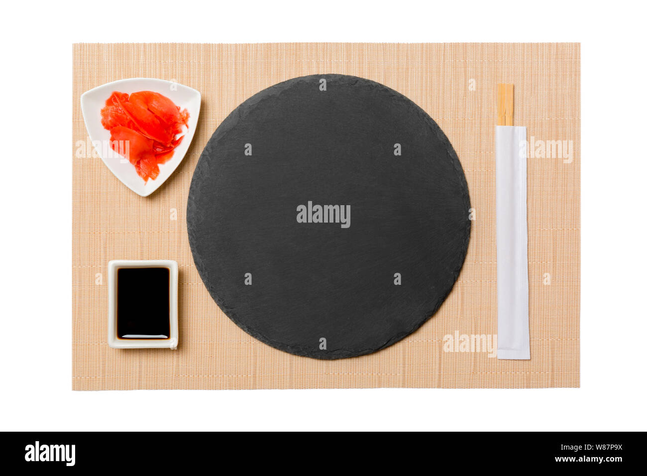 Empty plate with chopsticks for sushi and soy sauce, ginger on brown ...