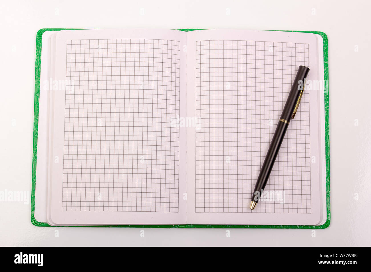 An open notebook on the table on a white background. Diary with white ...