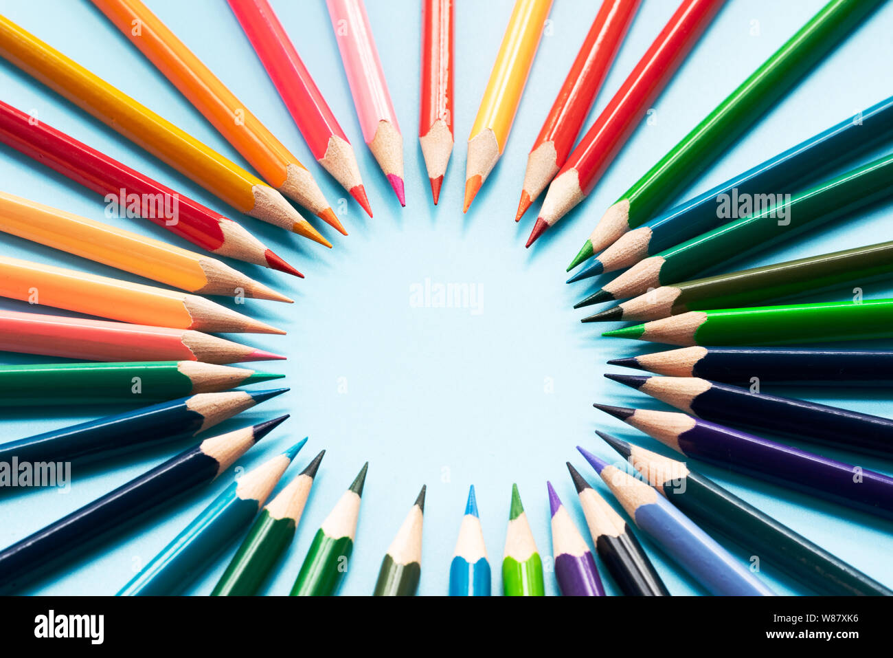 Teamwork concept. group of color pencil on blue background Stock Photo ...