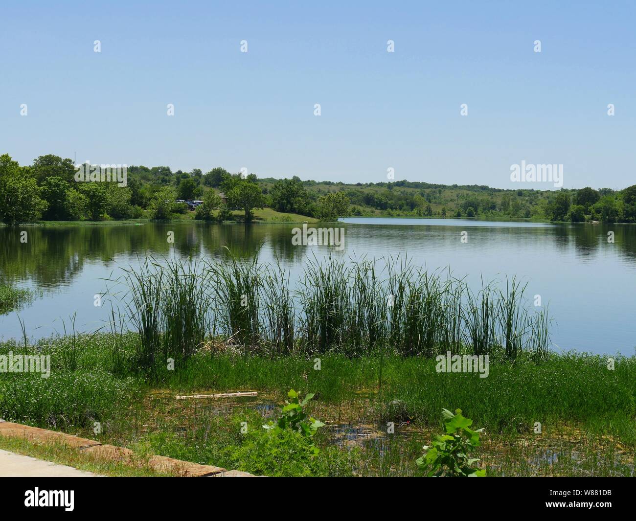 Wide view of Veteran Lake in Sulphur, Oklahoma with green grasses from ...