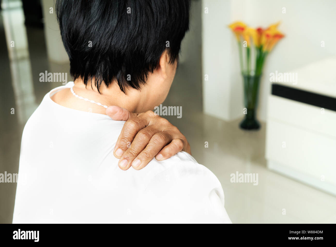 neck and shoulder pain, old woman suffering from neck and shoulder ...