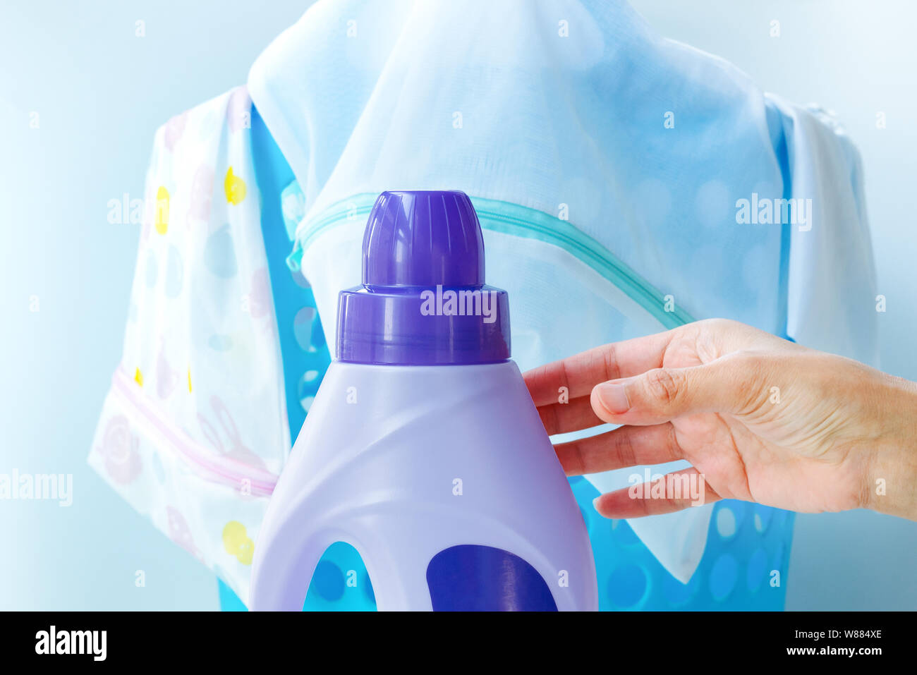 Woman hand pouring washer hi-res stock photography and images - Alamy