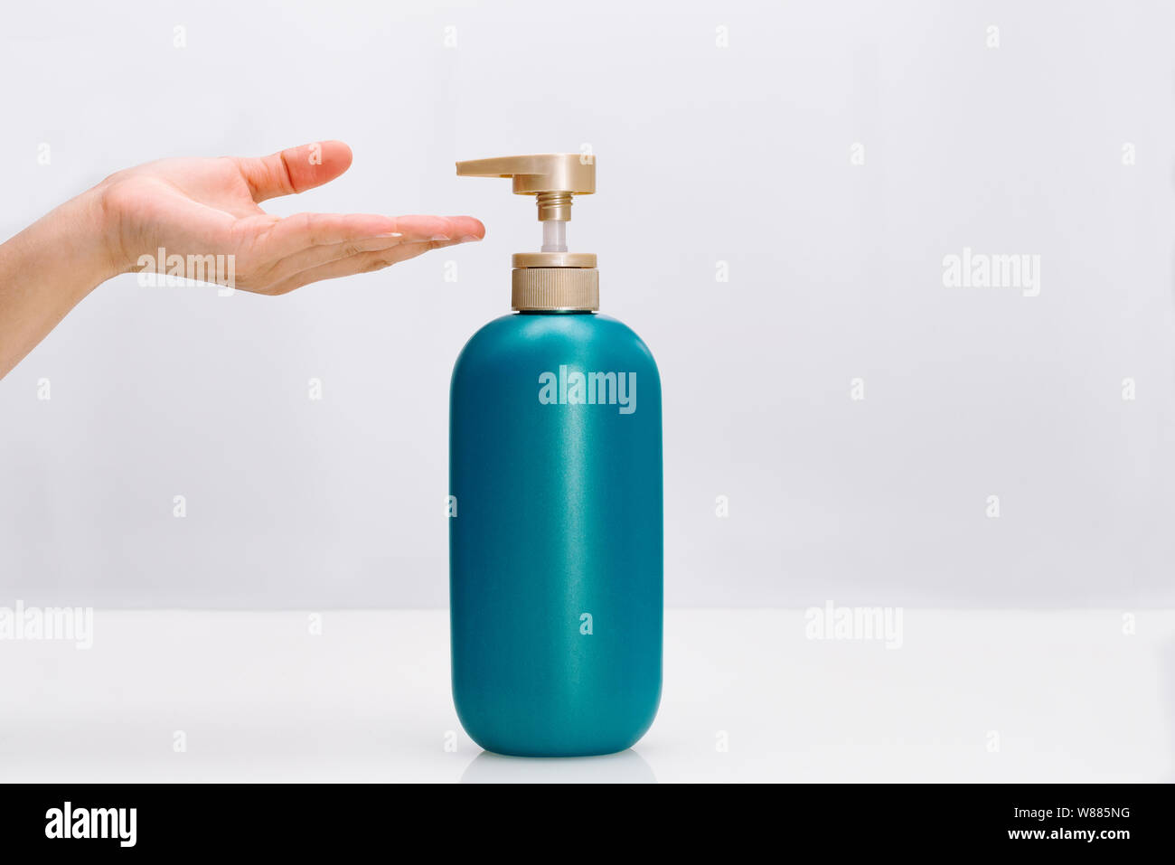 women hand apply hair shampoo conditioner bottle on white background ...