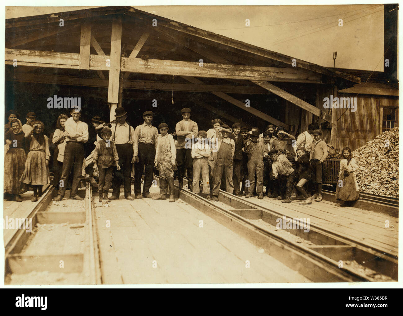 A few of the young shuckers at the Pass Packing Co Stock Photo - Alamy