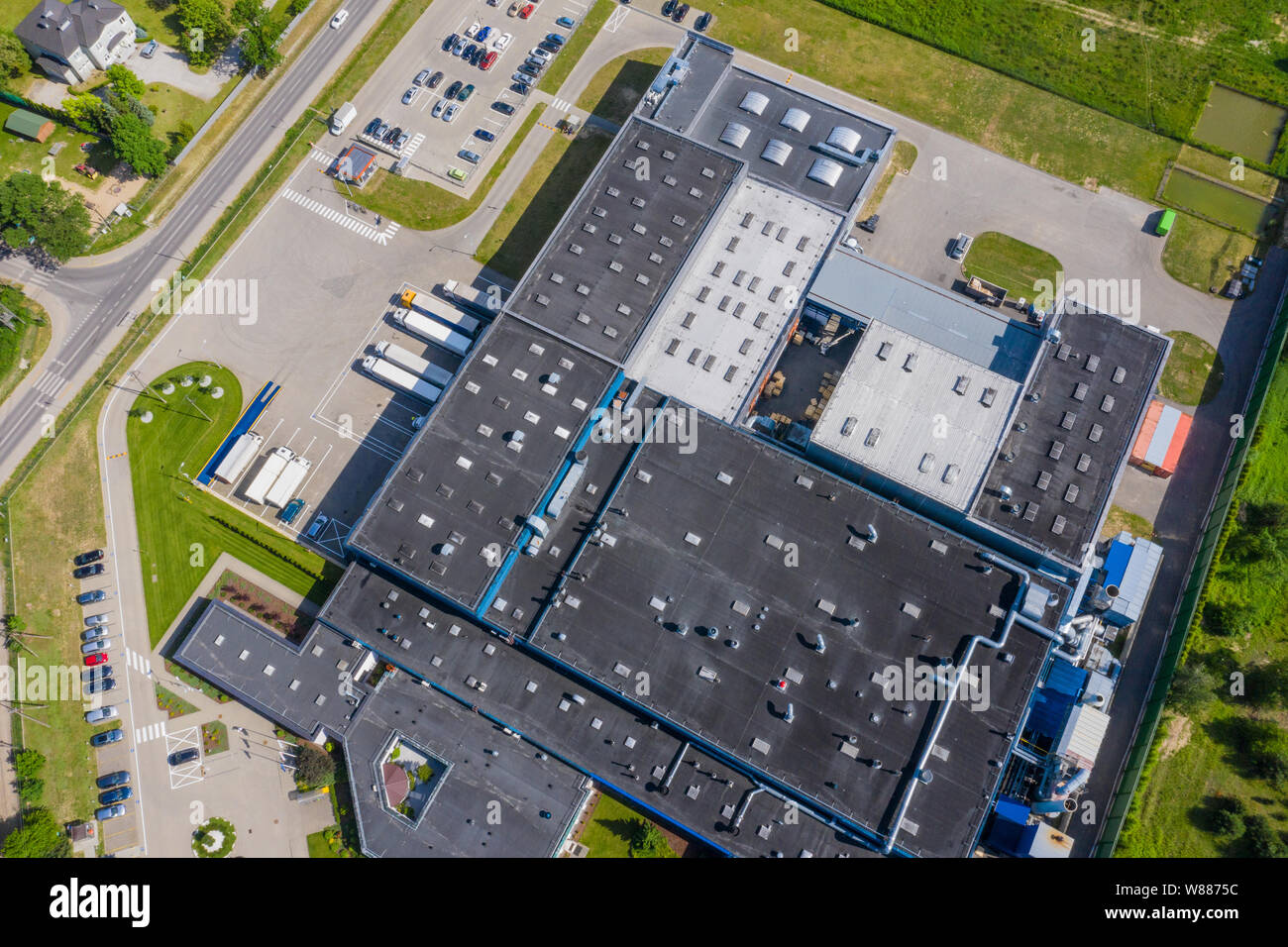Aerial Shot of Industrial Loading Area where Many Trucks Are Unloading ...