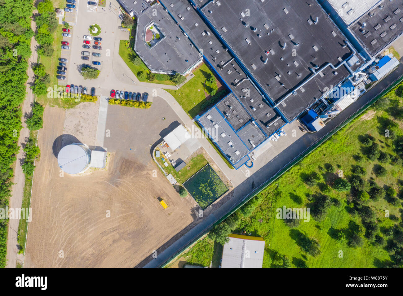 Aerial Shot of Industrial Loading Area where Many Trucks Are Unloading ...