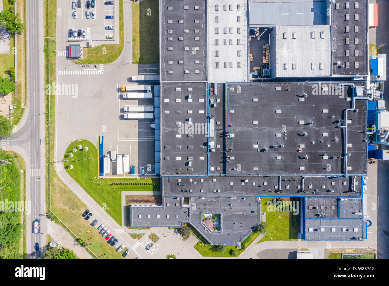 Aerial Shot of Industrial Loading Area where Many Trucks Are Unloading ...
