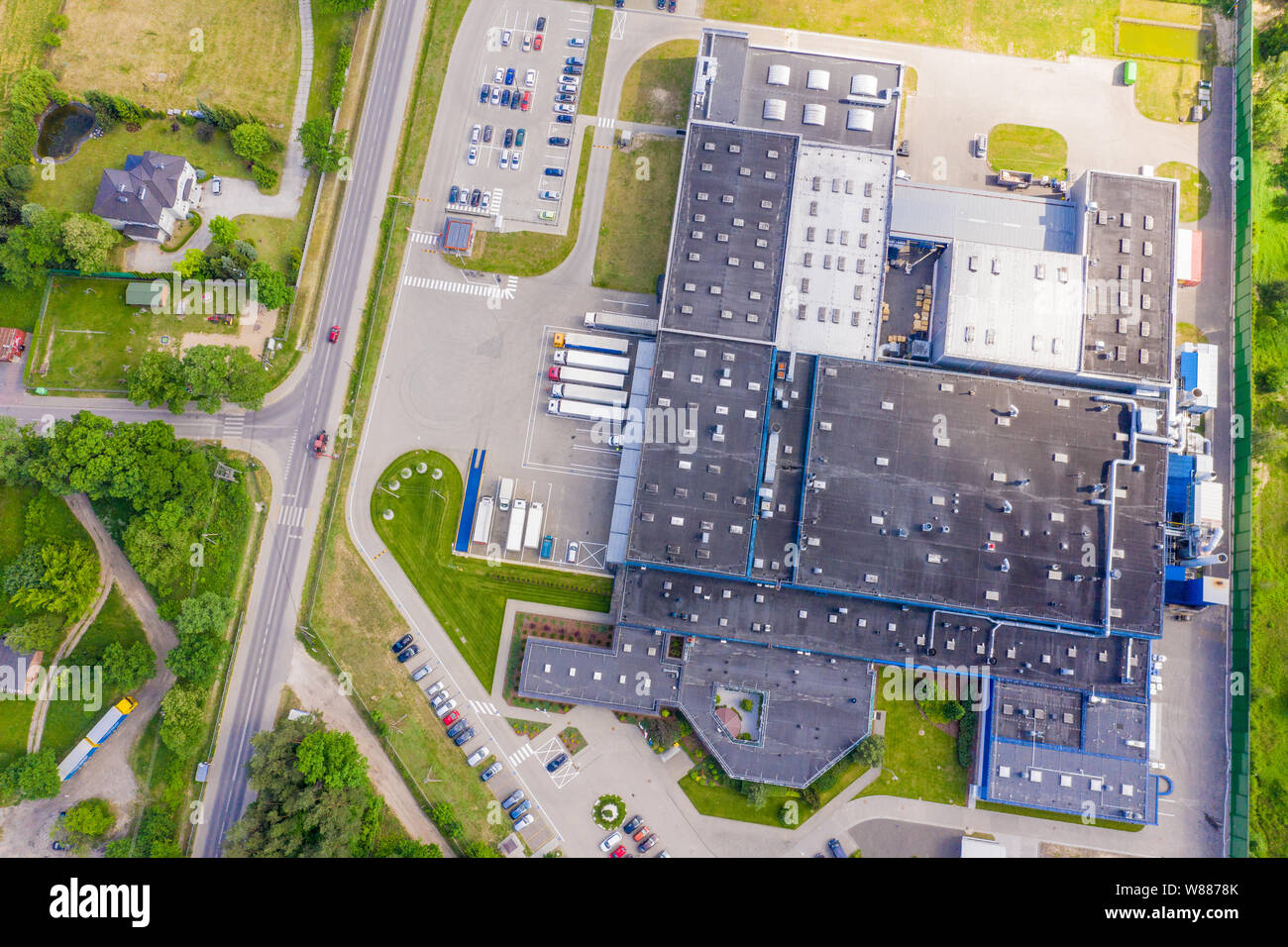 Aerial Shot of Industrial Warehouse Loading Dock where Many Truck with ...