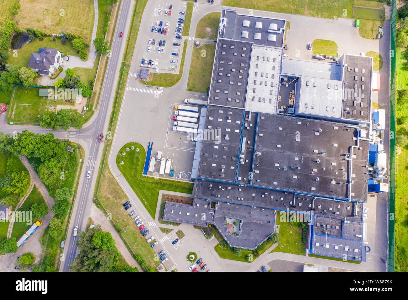 Aerial Shot of Industrial Warehouse Loading Dock where Many Truck with ...