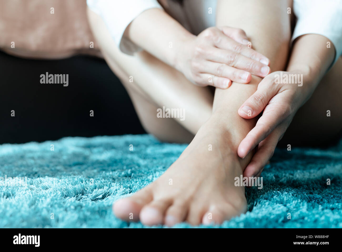 women leg ankle injury/painful, women touch the pain ankle leg Stock ...