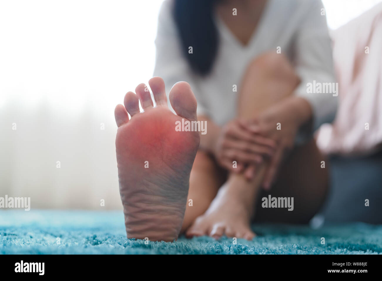 foot ankle injury pain women touch her foot painful, healthcare and ...