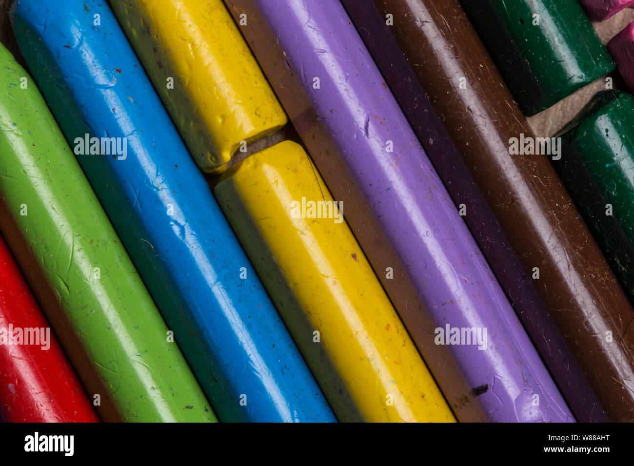Colourful crayons in a row close up still Stock Photo - Alamy