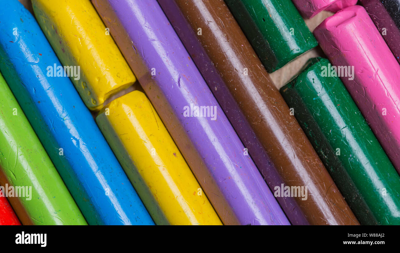 Colourful crayons in a row close up still Stock Photo - Alamy