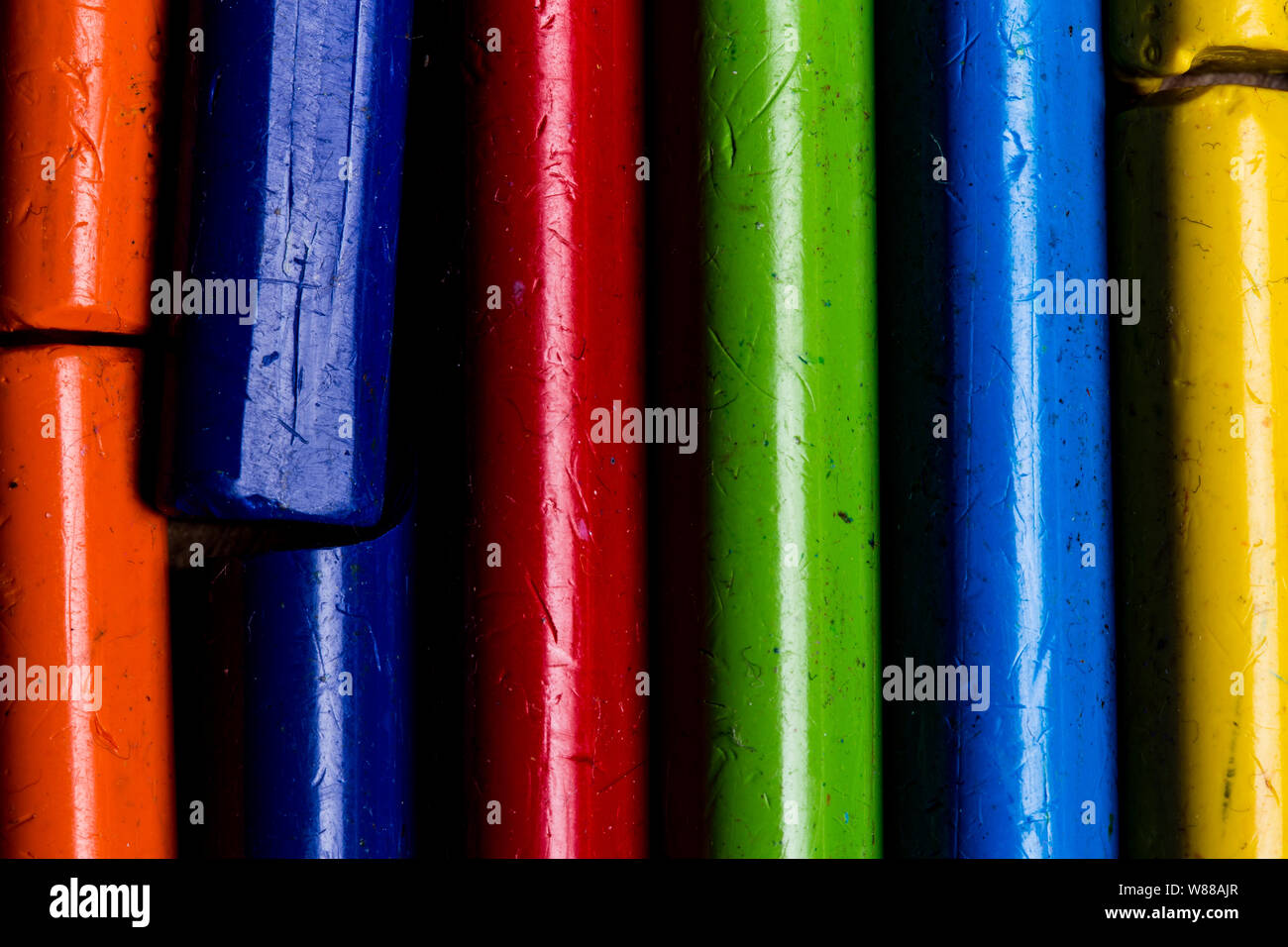 Colourful crayons in a row close up still Stock Photo - Alamy