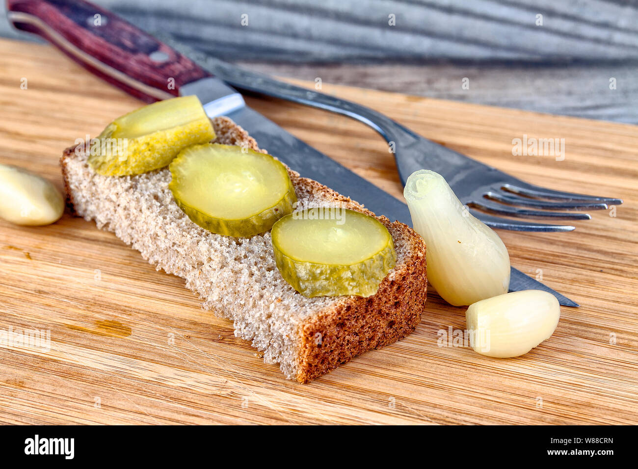 Marinated cucumber on a piece of bread Stock Photo - Alamy
