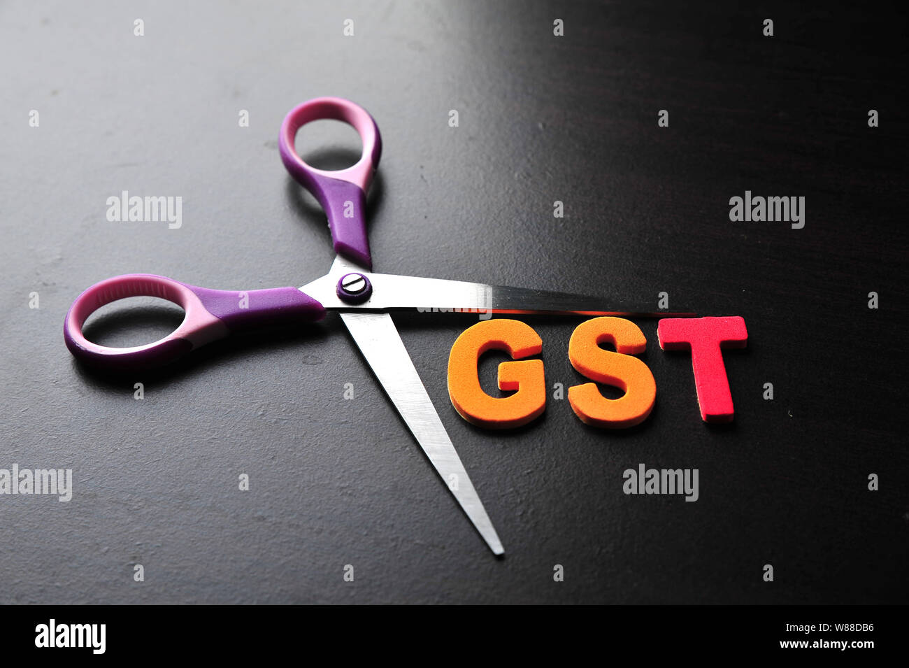scissors and the alphabet GST Stock Photo - Alamy