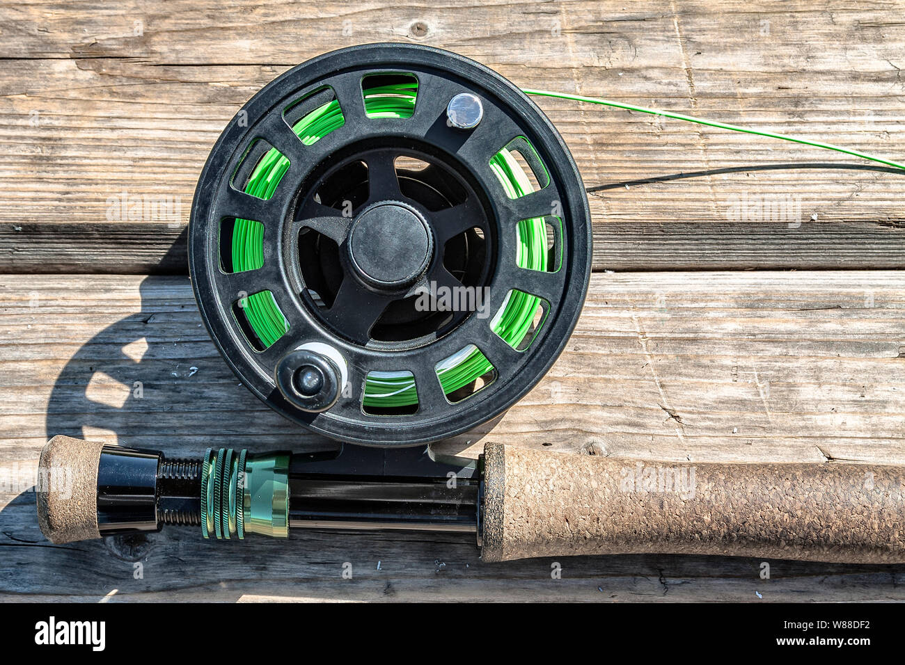 Fishing rods on the background of wooden boards Stock Photo - Alamy