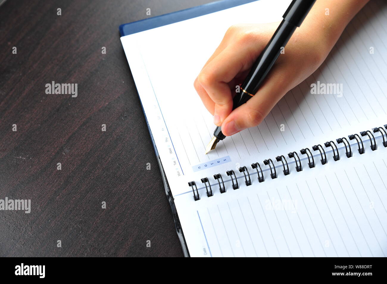 Hand Writing using Fountain Pen on a notebook Stock Photo - Alamy
